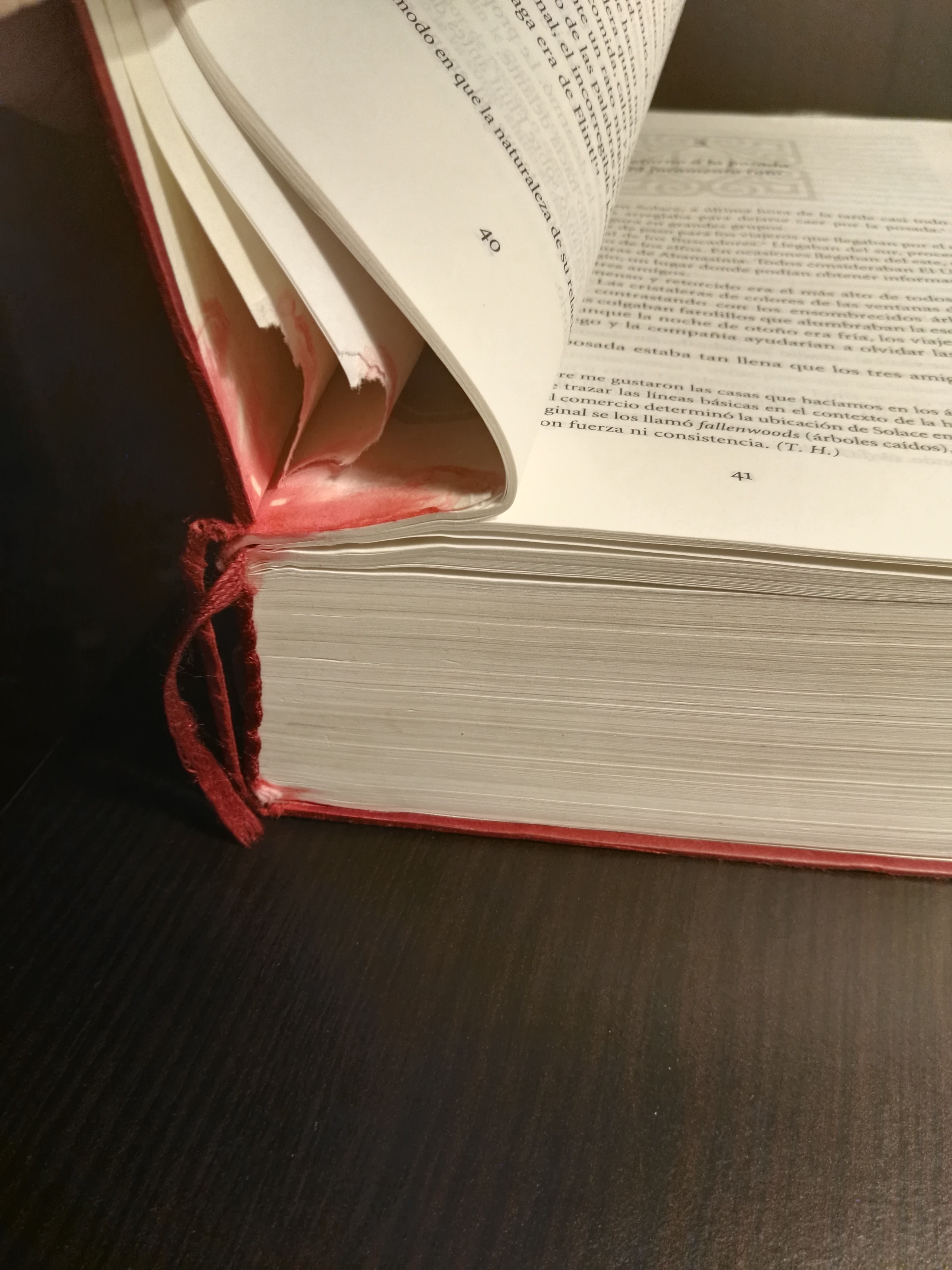 Pages of a book stuck together, making it partially unreadable. Help ...